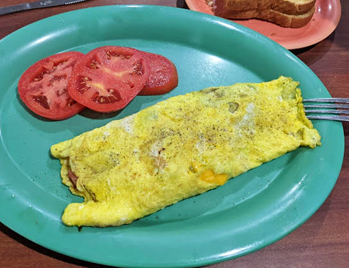 Breakfast of champions! Savory steak, scrambled eggs, and a biscuit that could make your grandmother question her own recipe.