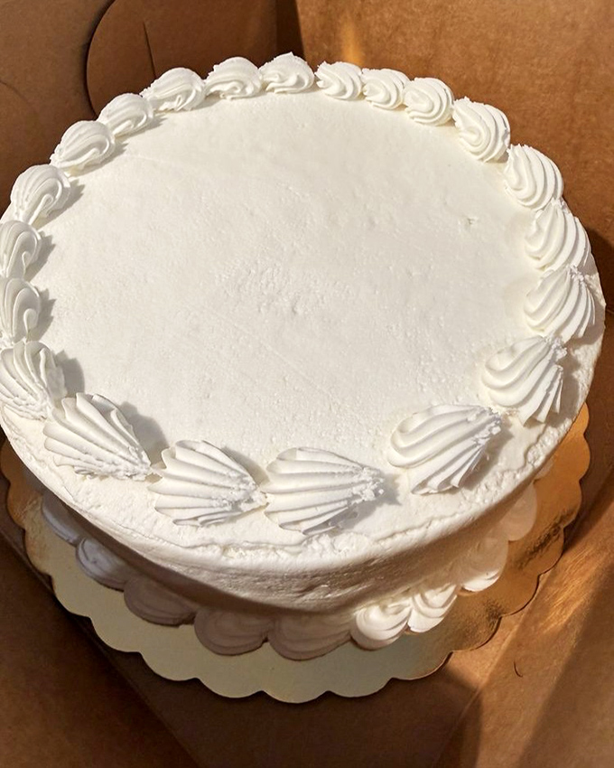 This pristine white cake isn't just dessert&mdash;it's a blank canvas awaiting life's celebrations, dressed in nothing but perfect buttercream swirls.