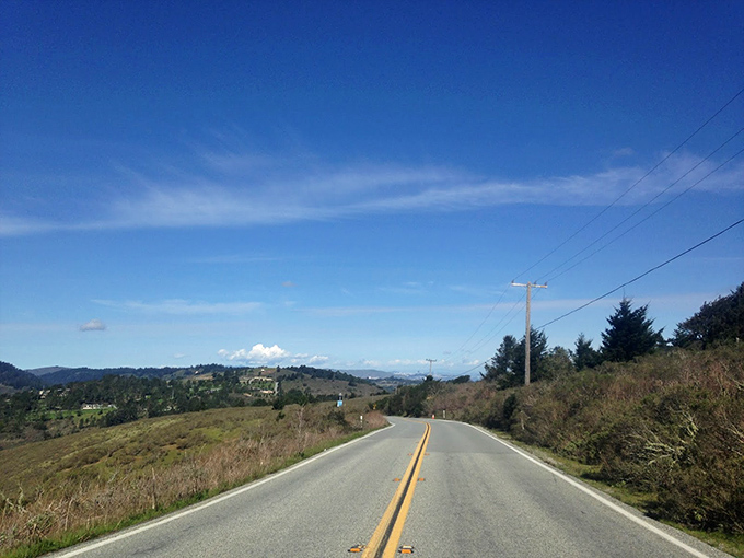 The open road beckons with possibilities as vast as the view, where every mile traveled feels like turning the page of a beautiful storybook.