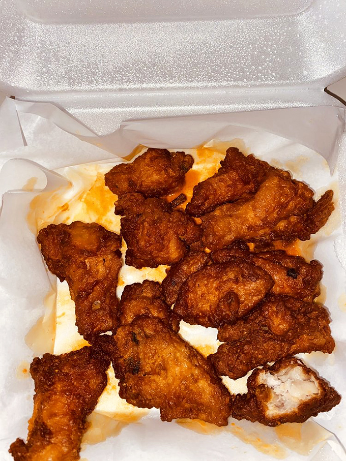 Crispy, golden-brown wings nestled in their takeout container like delicious little treasures. The kind of finger food worth getting your fingers dirty for.