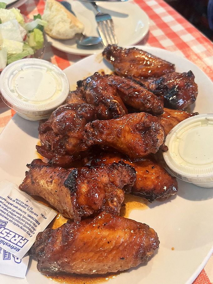 These glossy wings glisten like mahogany treasures, each one practically begging to be devoured with reckless abandon.