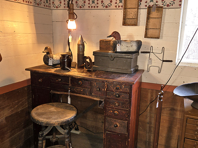 This weathered desk has probably seen more honest day's work than most of us. Those wooden drawers hold secrets from another era.