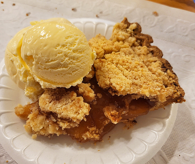 Apple pie à la mode that doesn't just speak to your taste buds – it sings a full-throated aria of cinnamon-spiced nostalgia.