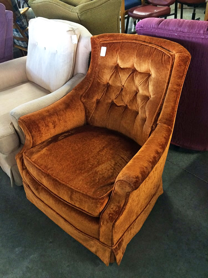 This burnt orange velvet armchair isn't just vintage seating&mdash;it's a time machine to 1970s conversation pits and cocktail parties.