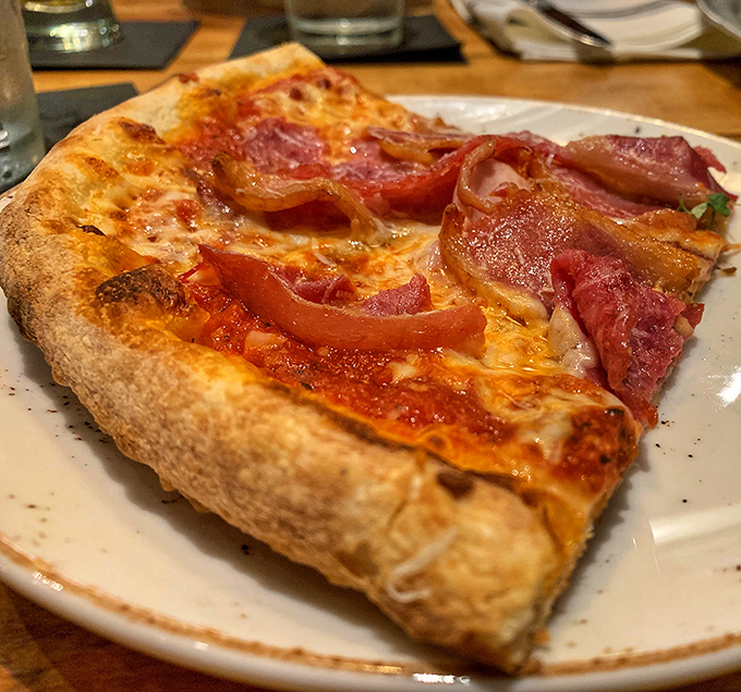 This isn't just pizza&mdash;it's a canvas where prosciutto and red sauce create an edible masterpiece that would make Michelangelo weep.