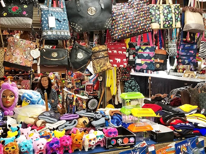 A kaleidoscope of colorful bags, plush toys, and accessories. This vendor's booth is like falling into the prize section of a carnival game.