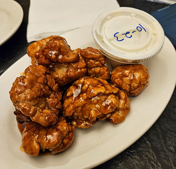 These boneless wings aren't just chicken nuggets with delusions of grandeur&mdash;they're sticky, sweet flavor bombs that demand a stack of napkins and zero shame.
