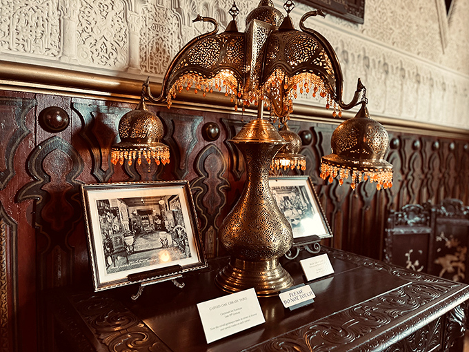 Not your average IKEA lamp! These intricate brass fixtures cast patterns across the walls that dance like Mediterranean sunlight through ancient latticework.