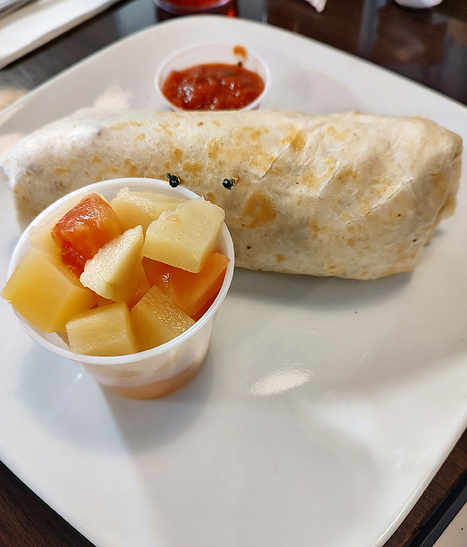 This breakfast burrito doesn't just start your day&mdash;it launches it into orbit, with fresh fruit on the side to maintain the illusion of virtue.