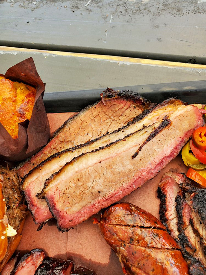 Brisket so perfectly rendered it should have its own art exhibition. That smoke ring deserves a frame and a spotlight.