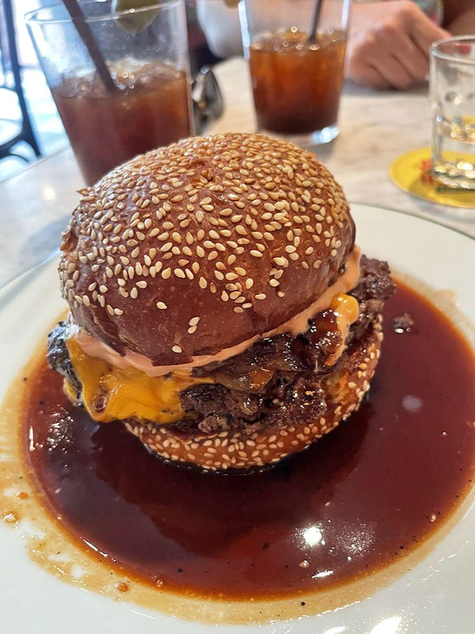 A burger swimming in savory jus with melted cheese cascading down the sides. This isn't just breaking diet rules&mdash;it's setting the rulebook on fire and dancing around the flames.