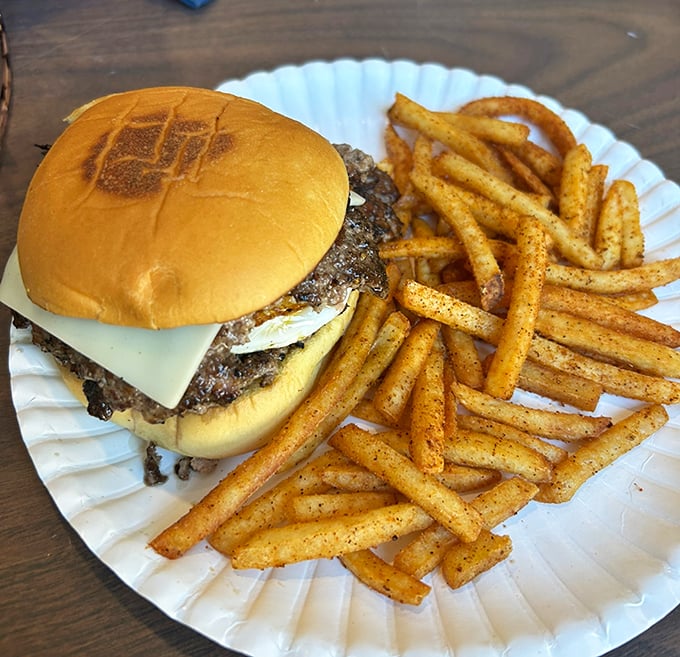 Their burger game is strong too &ndash; a perfectly seasoned patty with melty cheese and crispy, seasoned fries.