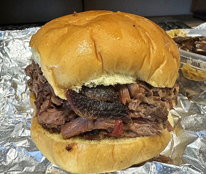 This isn't just a burger; it's an architectural marvel of smoke and patience. The bun is merely trying to contain greatness.