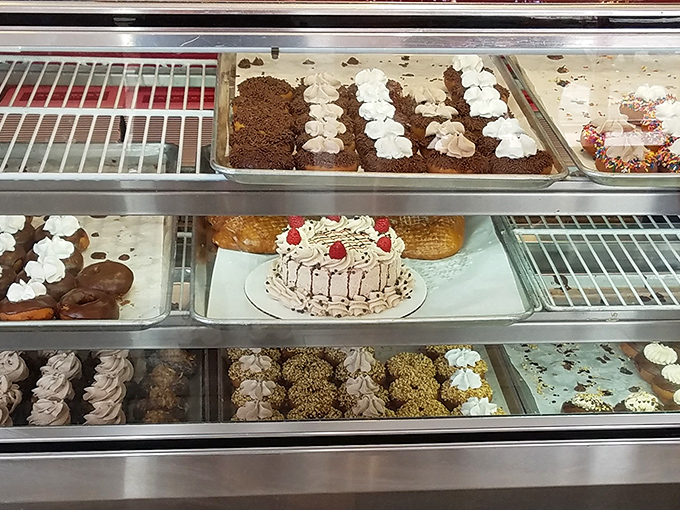 That cake sitting proudly among the donuts is like finding a Broadway star at a community theater&mdash;unexpected but absolutely welcome.