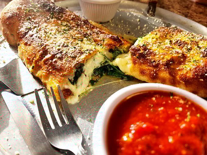 The calzone at Big PaPa's isn't just a meal&mdash;it's an event. Molten cheese stretches dramatically with each bite, demanding both your attention and your appetite.