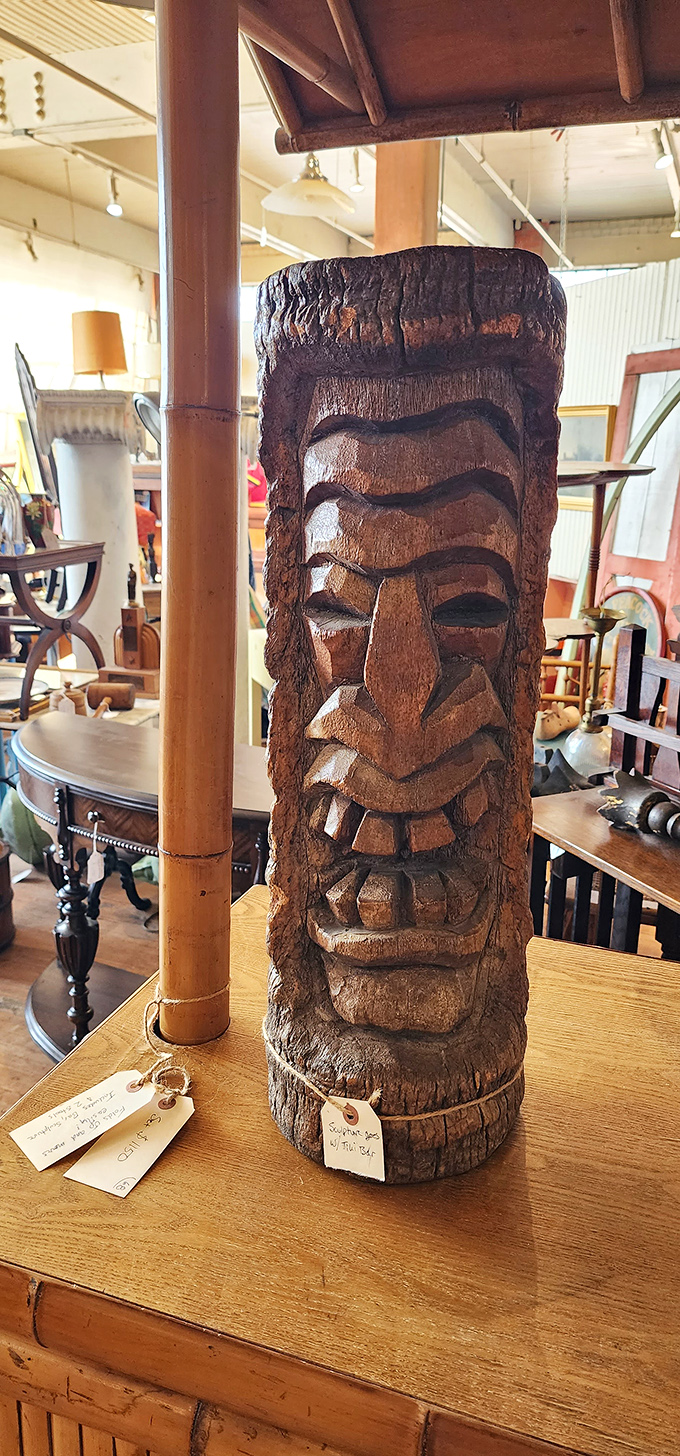 This carved tiki statue has seen things. Probably cocktail parties in the 1960s, but now it's ready to judge your home decor choices.