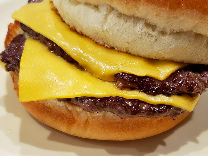 This isn't just a cheeseburger; it's a masterclass in American simplicity &ndash; perfectly melted cheese embracing a hand-formed patty like an old friend.