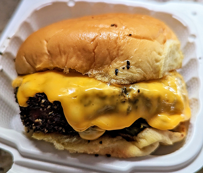 These aren't your average burgers – they're towering monuments to comfort food done absolutely right.