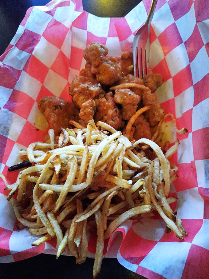 Crispy shoestring fries and buffalo bites that make you wonder if chicken had wings just so they could be served this way.