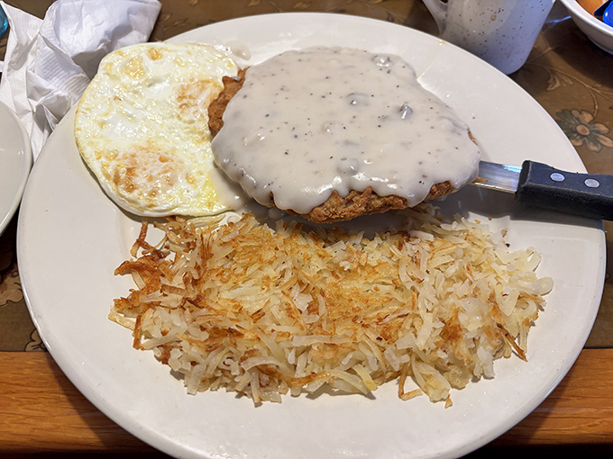 The chicken fried steak&mdash;a masterclass in crispy-meets-tender perfection, smothered in gravy that should be declared a national treasure.
