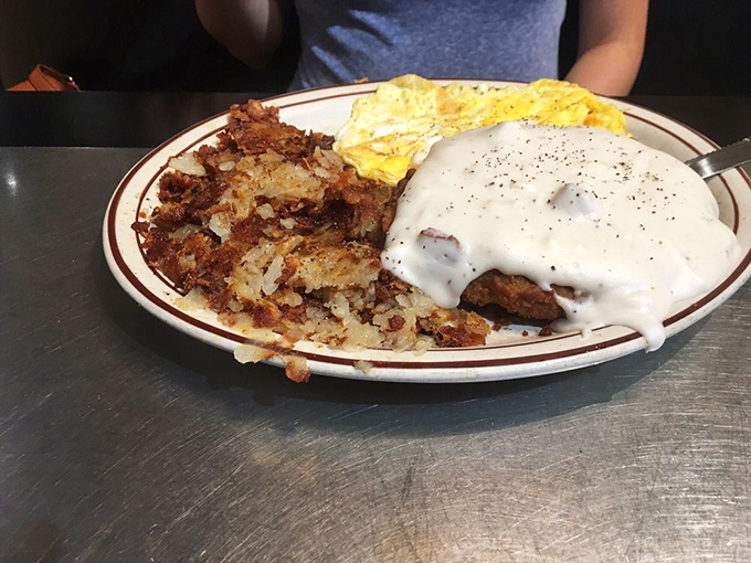 Chicken fried steak with gravy so good you'll want to write home about it. The crispy edges and peppery coating are the stuff of hangover-cure legends.