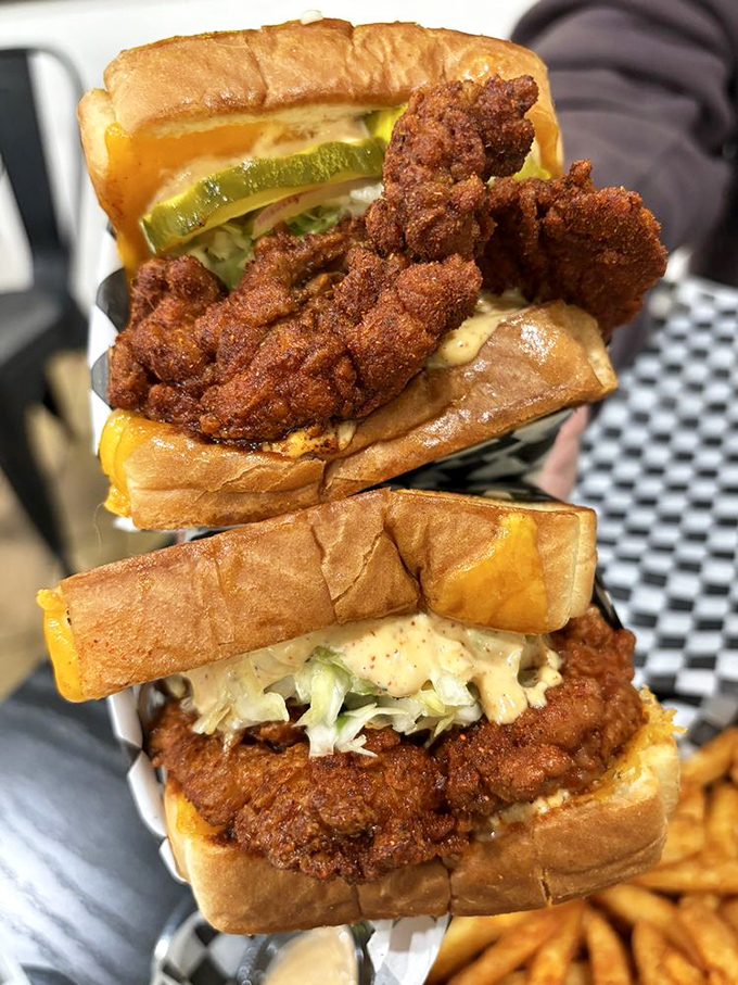 Architecture that makes sense: crispy exterior giving way to juicy chicken, melty cheese, and the perfect pickle-to-slaw ratio.