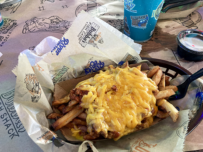 Cheese fries that laugh in the face of diet culture. The golden cheese blanket covering these crispy potatoes is the comfort food equivalent of a warm hug.