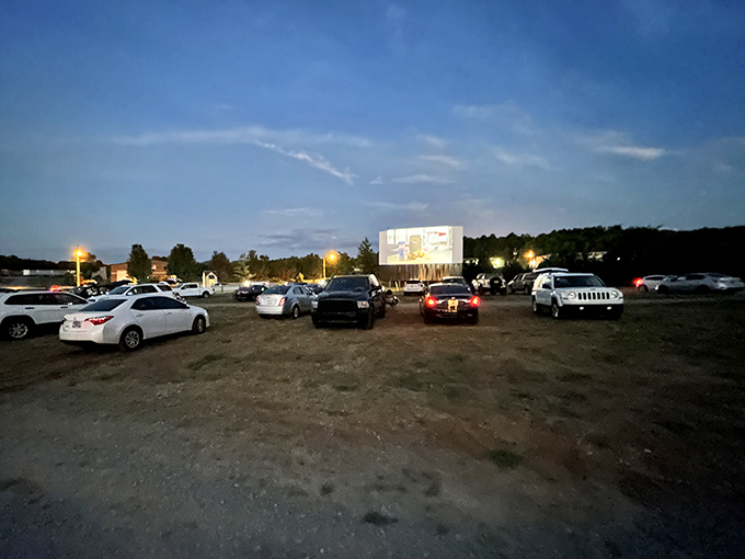 As darkness falls, the massive screen illuminates with cinematic glory, turning ordinary vehicles into private viewing boxes under a canopy of Tennessee stars.