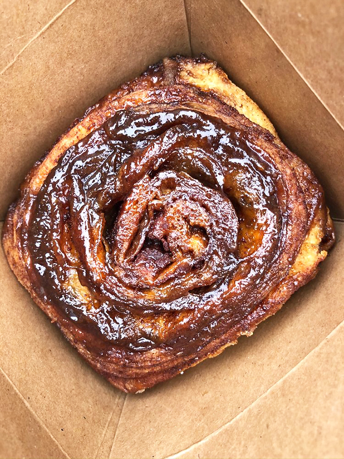 This isn't just a cinnamon roll; it's a spiral-bound love letter to butter, sugar, and spice that demands to be savored slowly.