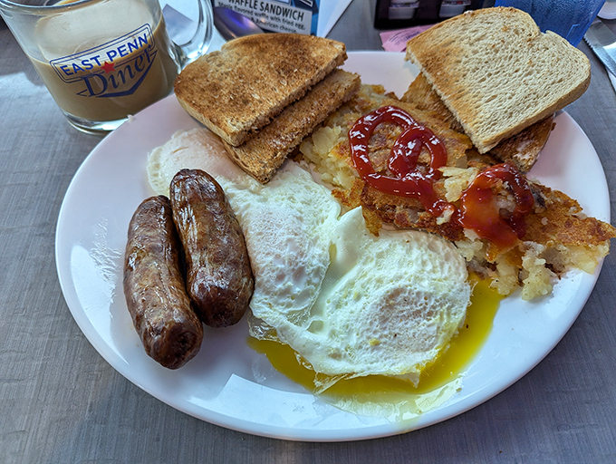 Breakfast perfection doesn't exi&mdash; wait, it does. Sunny-side eggs, sausage links, and hash browns with that ideal crispy-to-fluffy ratio that would make your grandmother proud.