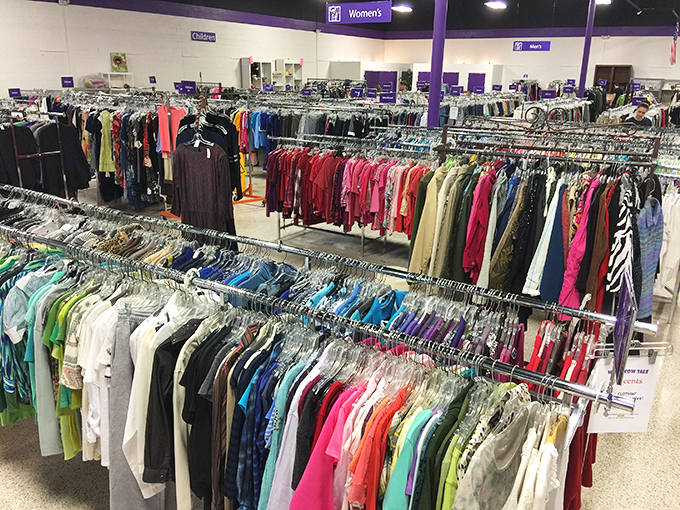 A rainbow of women's clothing arranged with surprising precision&mdash;proof that organization and second-hand shopping aren't mutually exclusive concepts. 