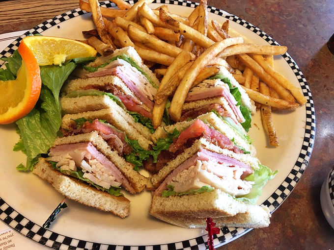 Behold the architectural marvel that is the club sandwich—layers of turkey, bacon, and avocado creating the skyscraper Frank Lloyd Wright would have designed if he were hungry.