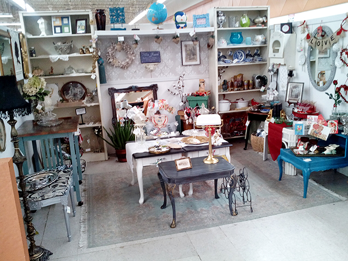 A shabby-chic wonderland where every table tells a story, and that blue farmhouse piece is practically begging to host your next Sunday brunch.