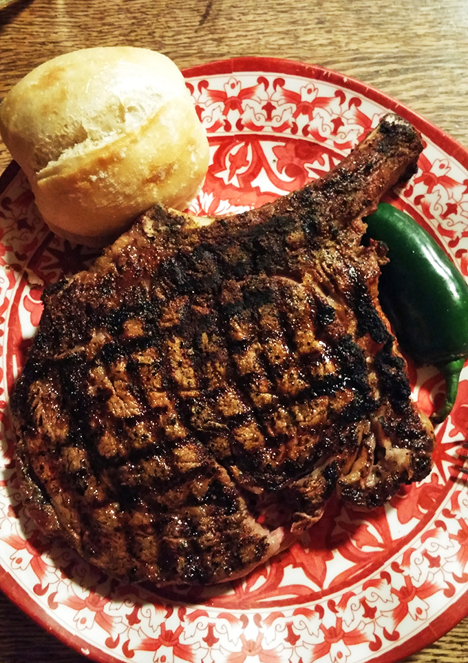 This cowboy ribeye isn't just dinner &ndash; it's an event. The grill marks tell stories of mesquite smoke and patient expertise.