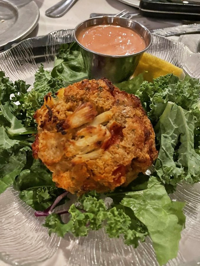 Crab cakes that are actually crab, not breadcrumbs with a seafood rumor. Served with a sauce worth bottling and taking home.