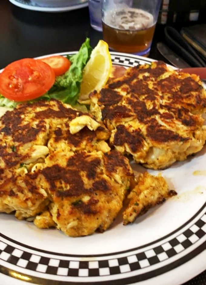 Maryland's culinary religion on a plate &ndash; these golden-brown crab cakes contain more jumbo lump meat than most relationships contain commitment.