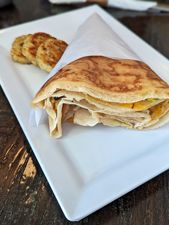 Golden, paper-thin perfection wrapped around savory fillings. Those potato cakes on the side aren't just accessories&mdash;they're scene-stealers.