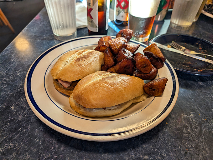 The Cuban sandwich arrives like a well-structured argument: pressed, convincing, and leaving no room for debate about its deliciousness.