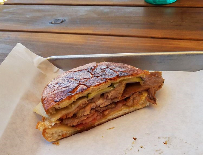 The Cubano doesn't just bridge cultures—it bridges the gap between hunger and happiness with layers of porky perfection.