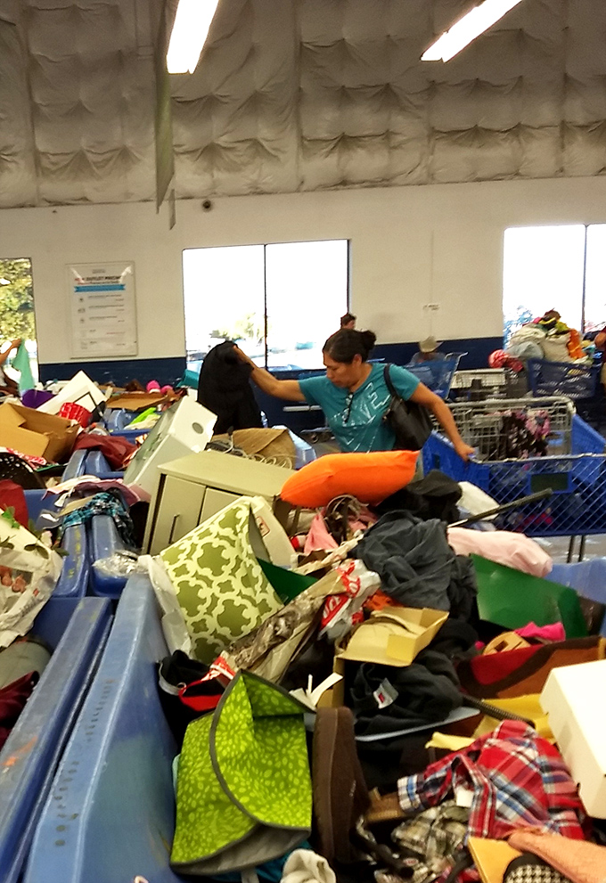 Diving deep into the merchandise mountain requires technique and determination. This treasure hunter demonstrates the art of the dig.
