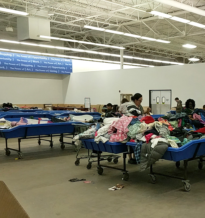 Treasure hunters in their natural habitat, sifting through textiles like archaeologists uncovering artifacts from suburban excavations.