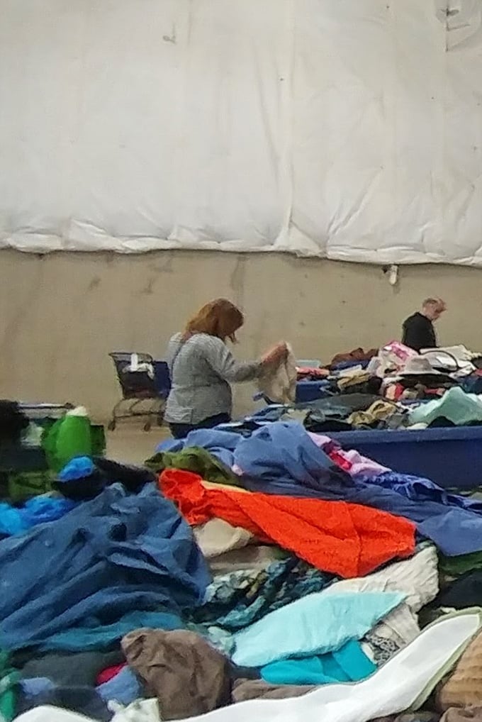 Serious shoppers in their element, methodically sifting through textile treasures. That focused concentration is the same look my dad had when panning for gold in '49.
