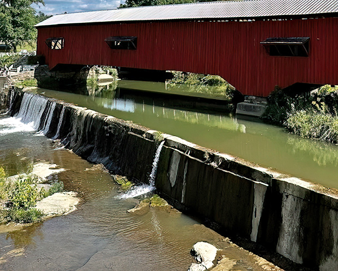 Water cascades over the dam with hypnotic consistency, proving that some of life's most captivating entertainment existed long before Netflix. 