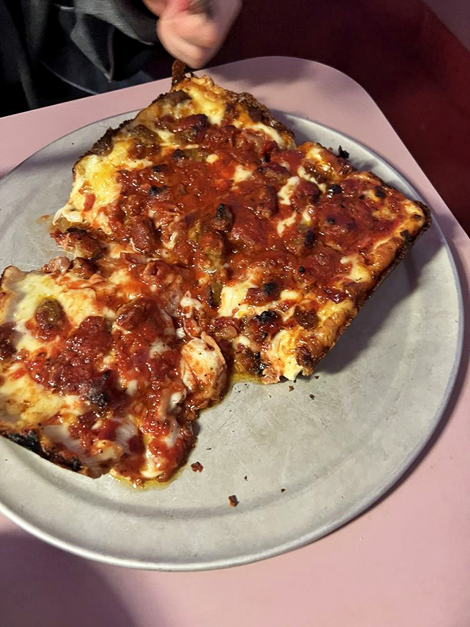 That moment when cheese meets crust in a marriage so perfect it makes you believe in love again.