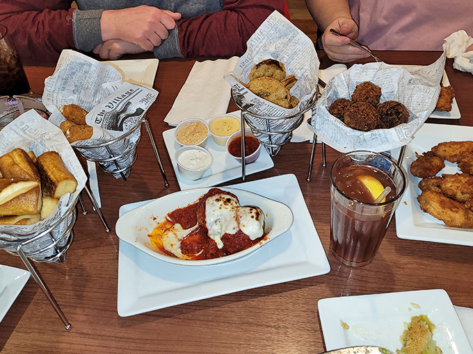 A table spread that turns dining companions into competitors. Those wire baskets of fried goodness are about to spark friendly feuds over who gets the last bite.