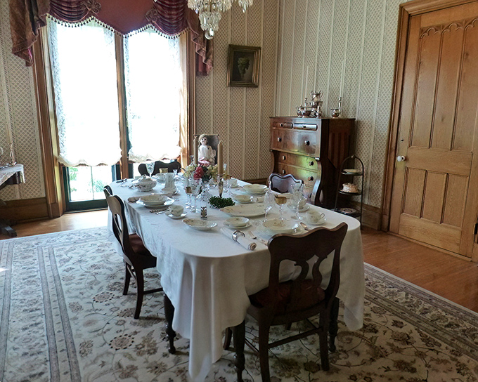 Dinner is served! The Victorian dining room stands ready for guests who will never arrive, a perfect tableau of 19th-century entertaining frozen in time.