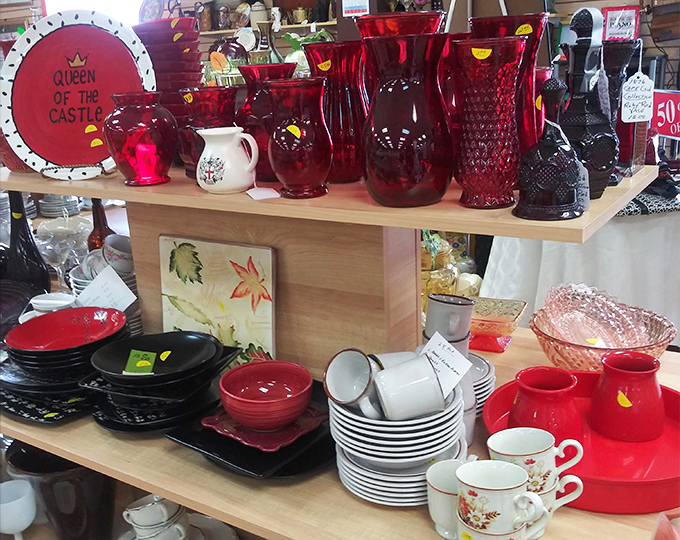 Ruby red glassware that would make Dorothy's slippers jealous, arranged alongside everyday dishes waiting for their second act.