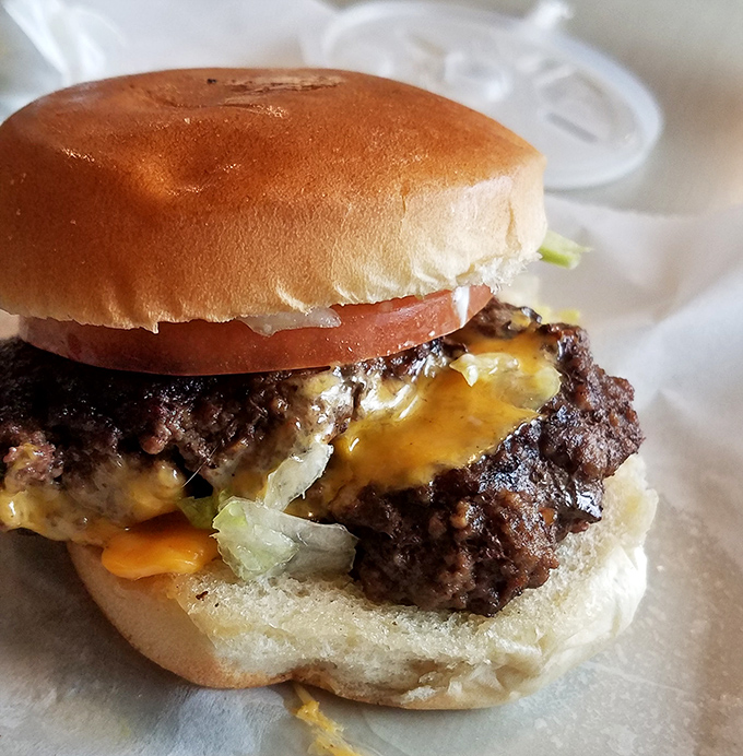 This isn't just a burger; it's edible history. The cheese melts into the patty like it's finding its soulmate after years of searching.