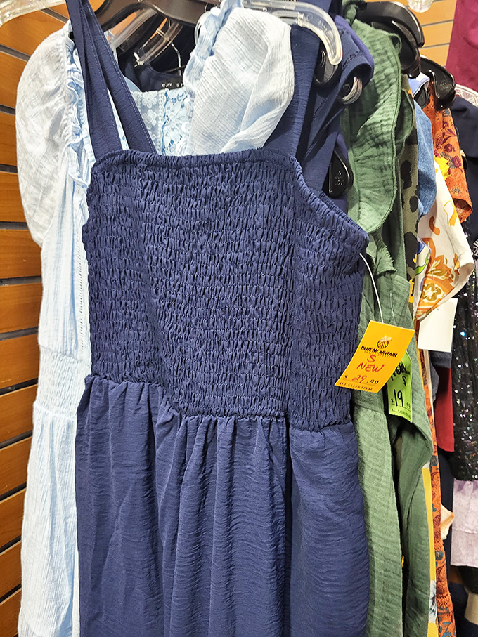 A brand-new blue sundress with its original tag still attached &ndash; proof that "thrifting" and "new wardrobe" aren't mutually exclusive concepts.