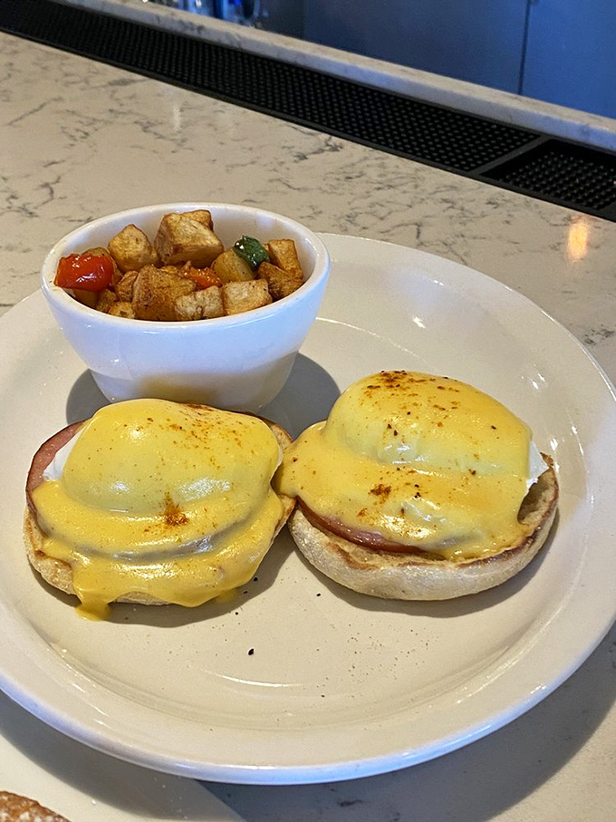 Classic eggs Benedict executed with textbook perfection&mdash;the hollandaise sauce practically performing Swan Lake across those English muffins.